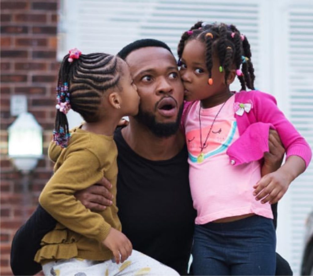Caption this photo of Singer Flavour and his daughters - Expressive Info