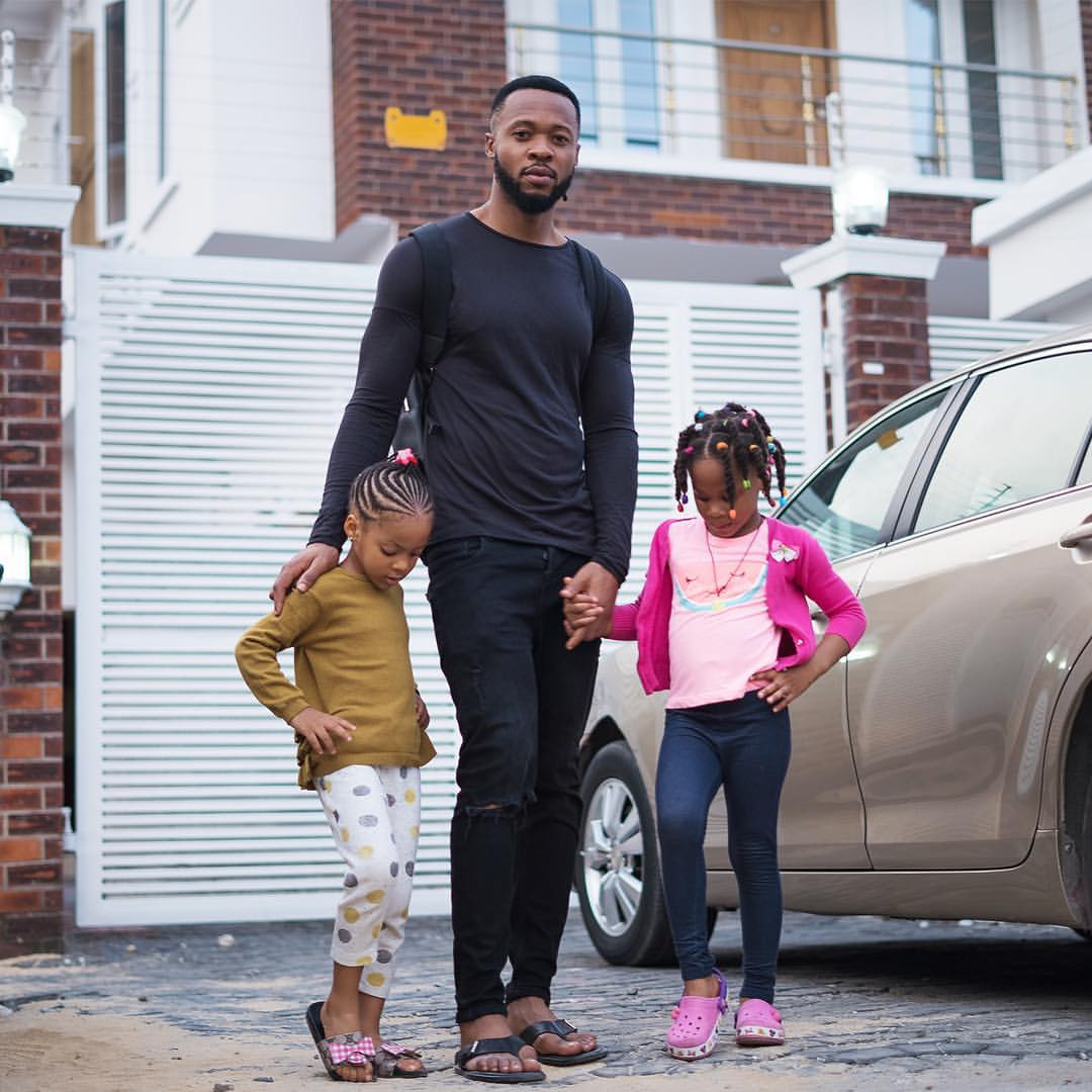 Caption this photo of Singer Flavour and his daughters - Expressive Info